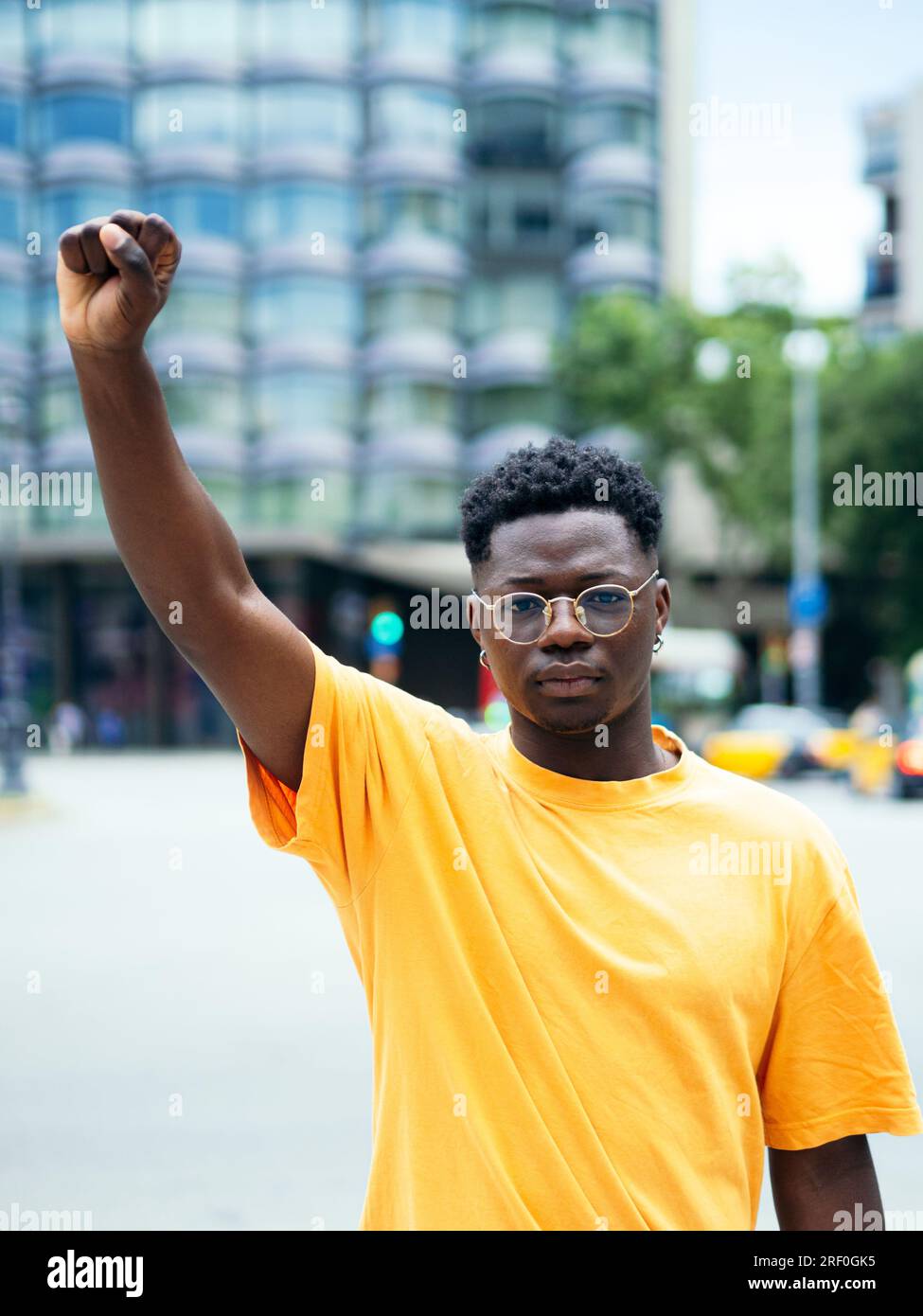 Young african american man with afro hair with fist raised as anti ...