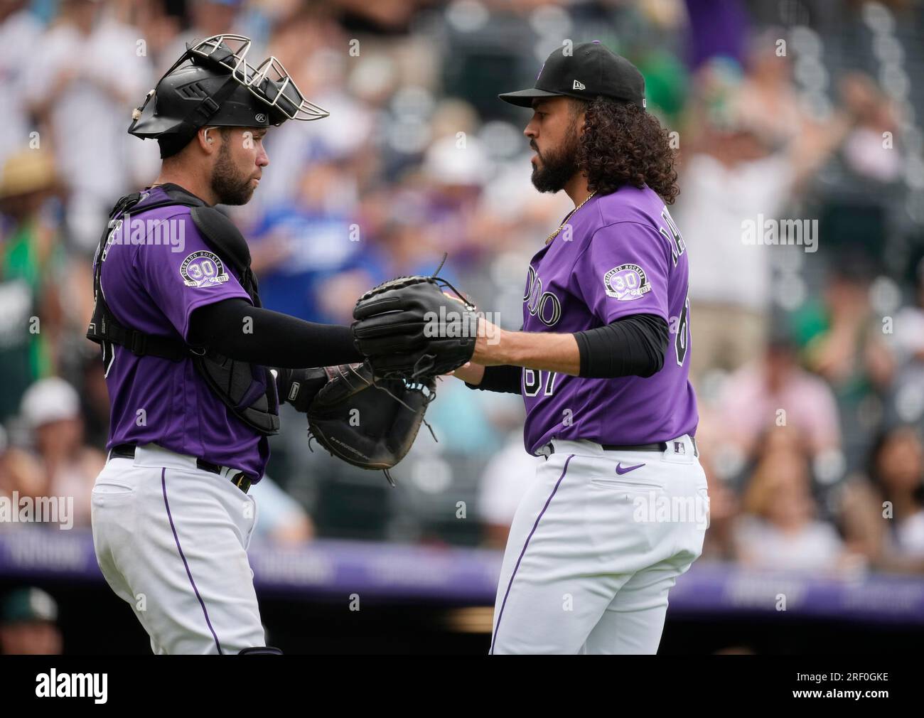 Colorado Rockies catcher Austin Wynns, left, congratulates relief ...