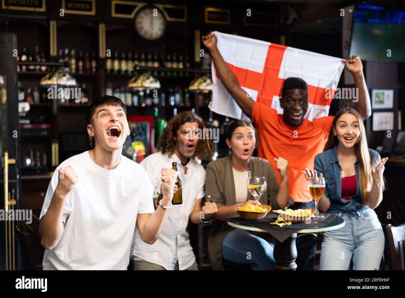 Group of England football team fans spending time in bar Stock Photo ...