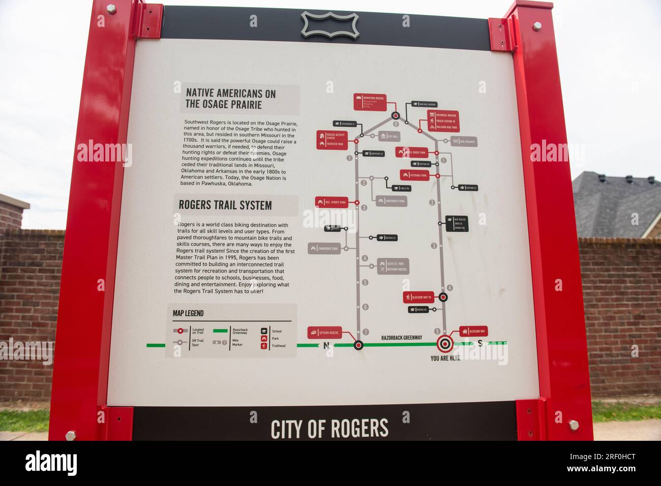A signpost in Rogers, Arkansas marking the Razorback Greenway Stock ...