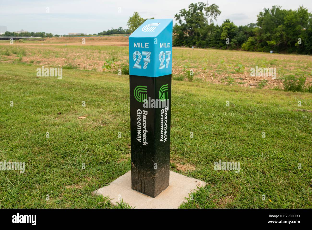 A signpost in Rogers, Arkansas marking the Razorback Greenway Stock ...