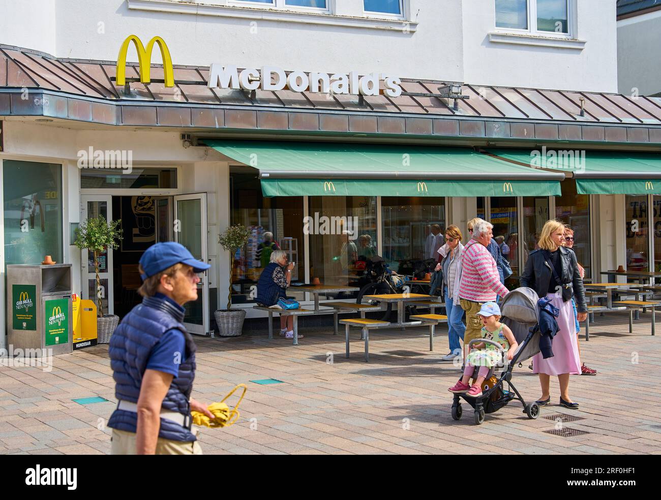 Tourists in the city with McDonalds fast food restaurant on June 24 ...