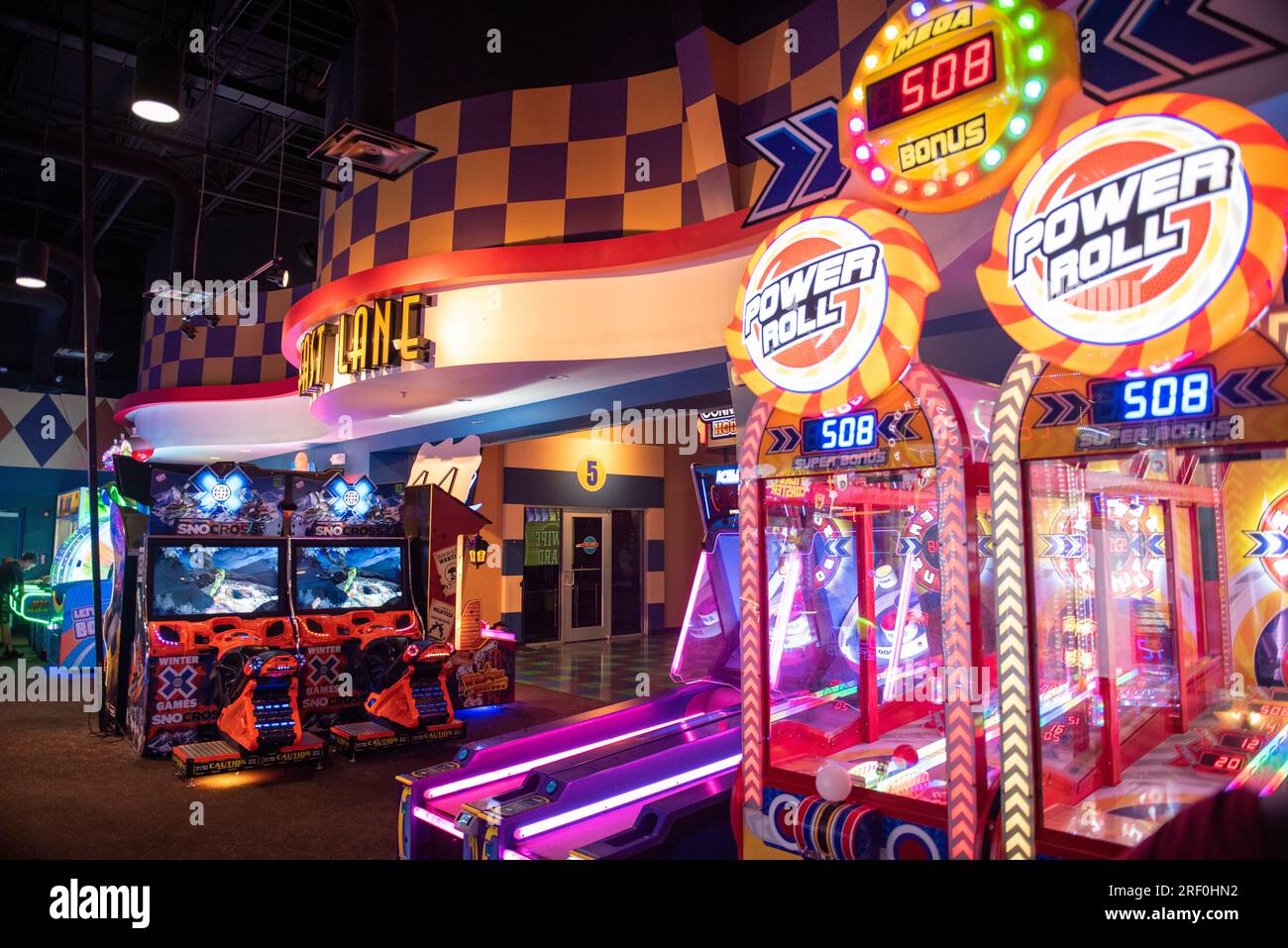 Interior of a gaming arcade with bright lights to attract players Stock ...