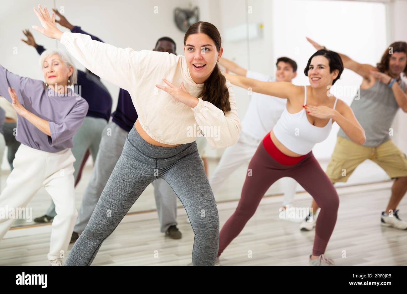 Group of adult people practices dance aerobics Stock Photo - Alamy