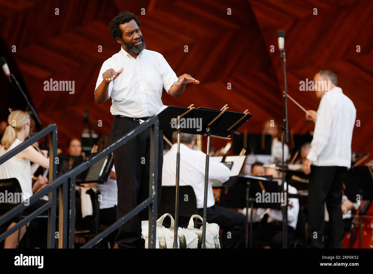 A sign language interpreter performs with the Boston Landmarks ...