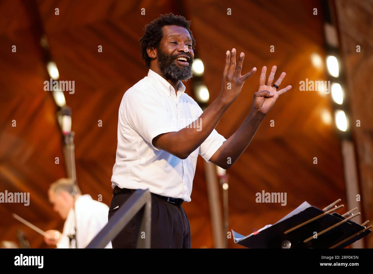 A sign language interpreter performs with the Boston Landmarks ...