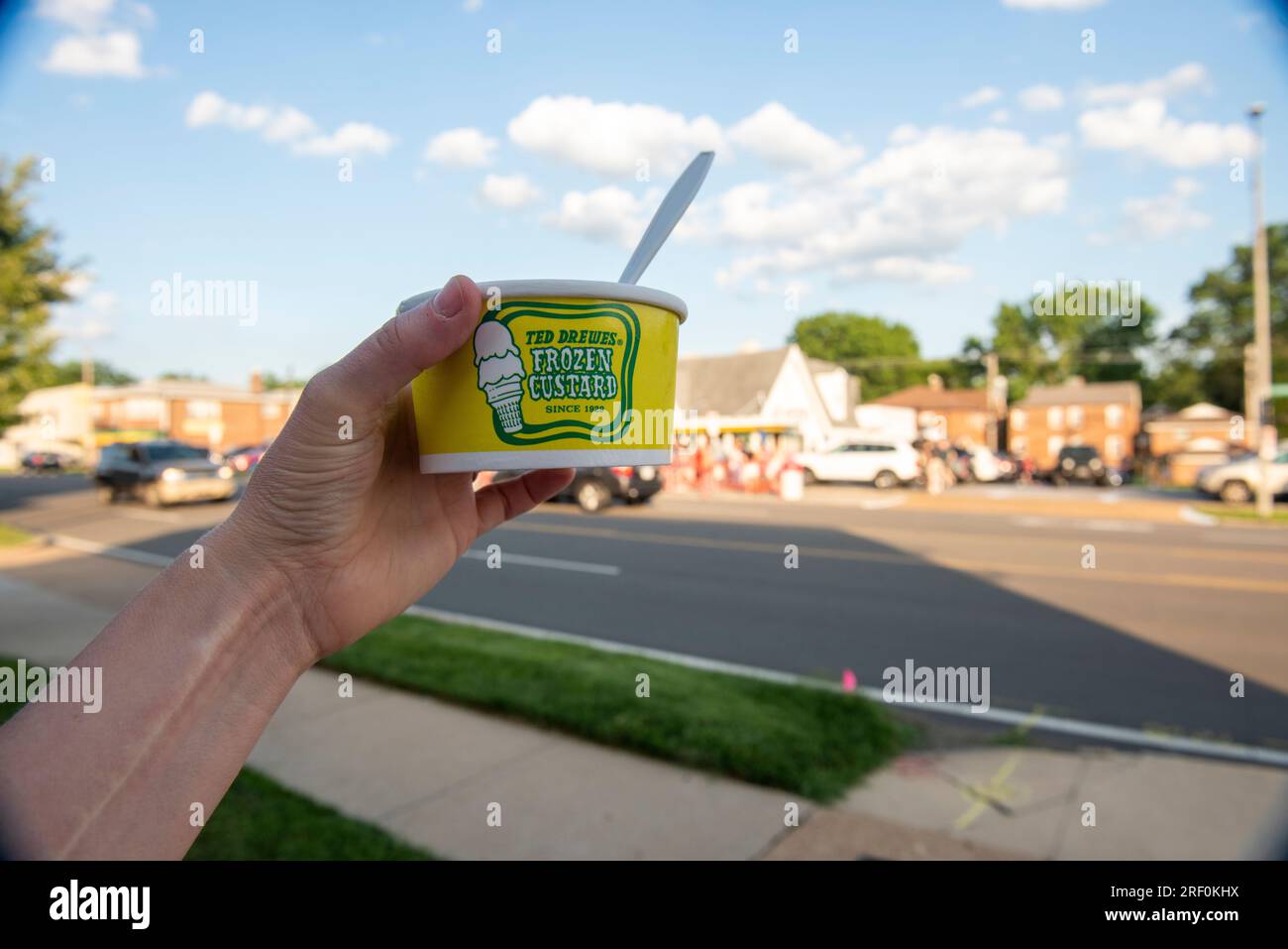 A cup of Ted Drewes frozen custard with the building in the background ...