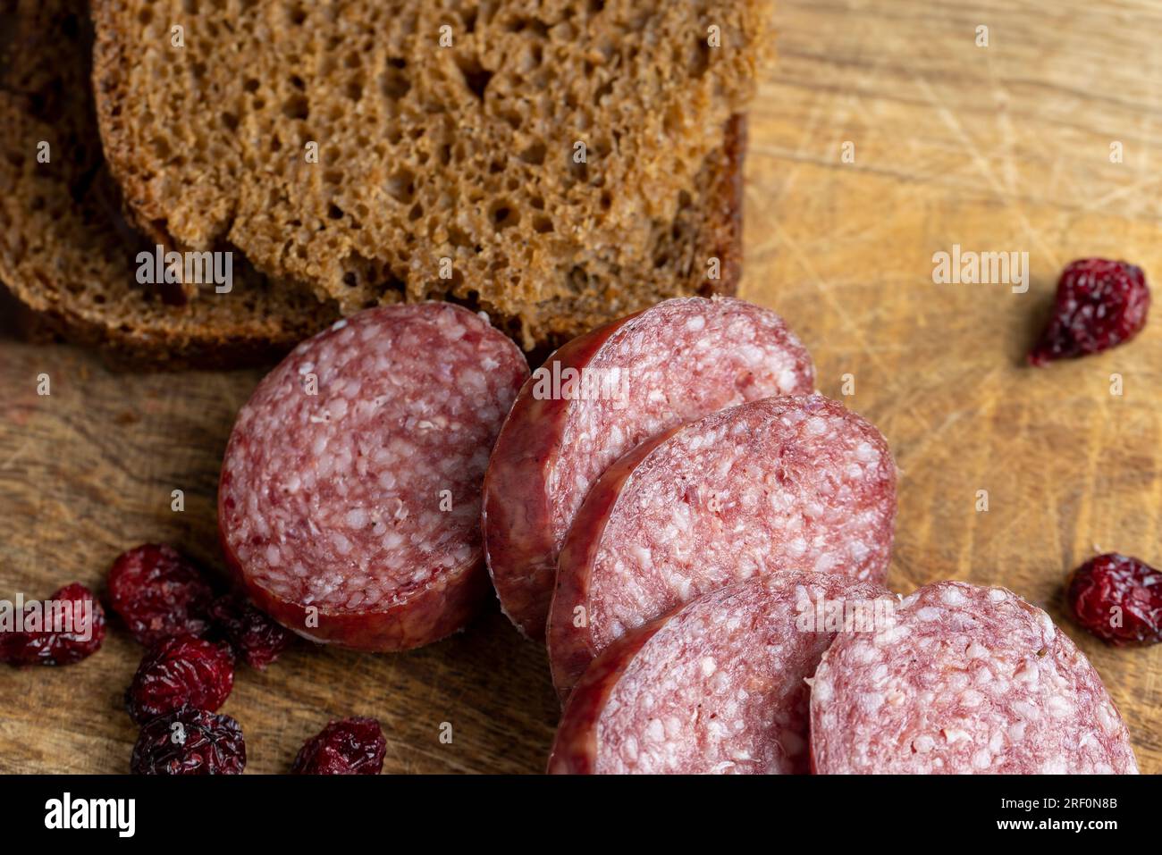 Sausage of moose meat cut into pieces, preparation of snacks from wild ...