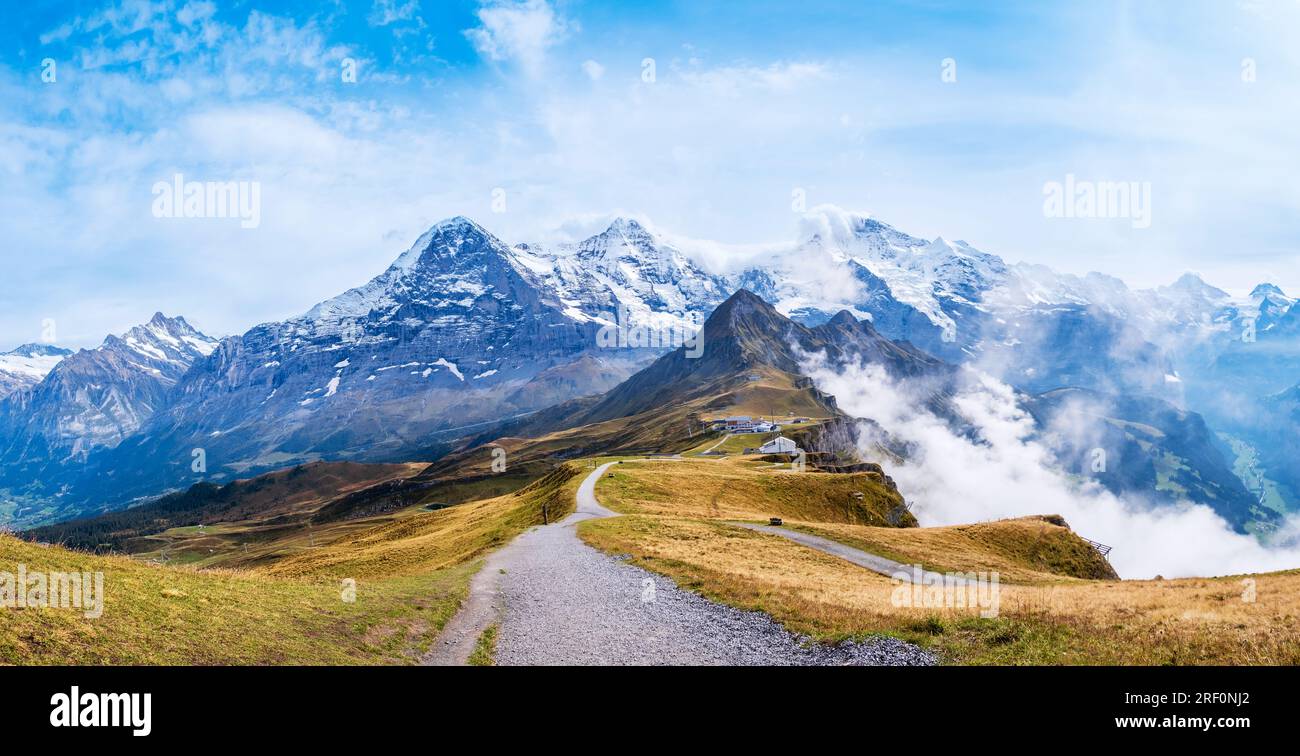 Autumn in Swiss Alps. Hiking trail on top of Mannlichen near Wengen and ...