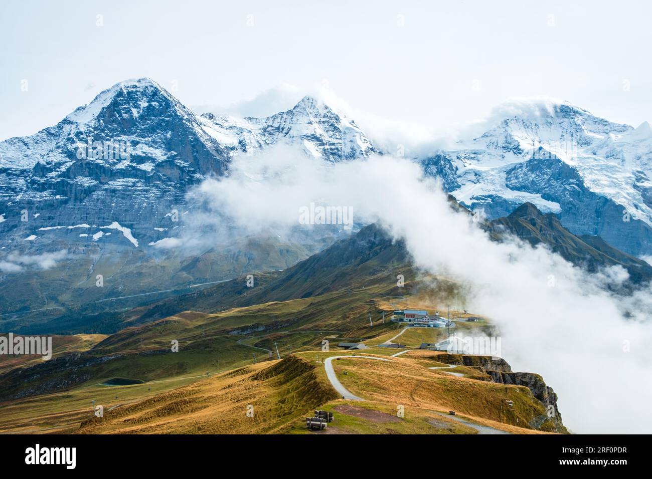 Autumn in Swiss Alps. Hiking trail on top of Mannlichen near Wengen and ...