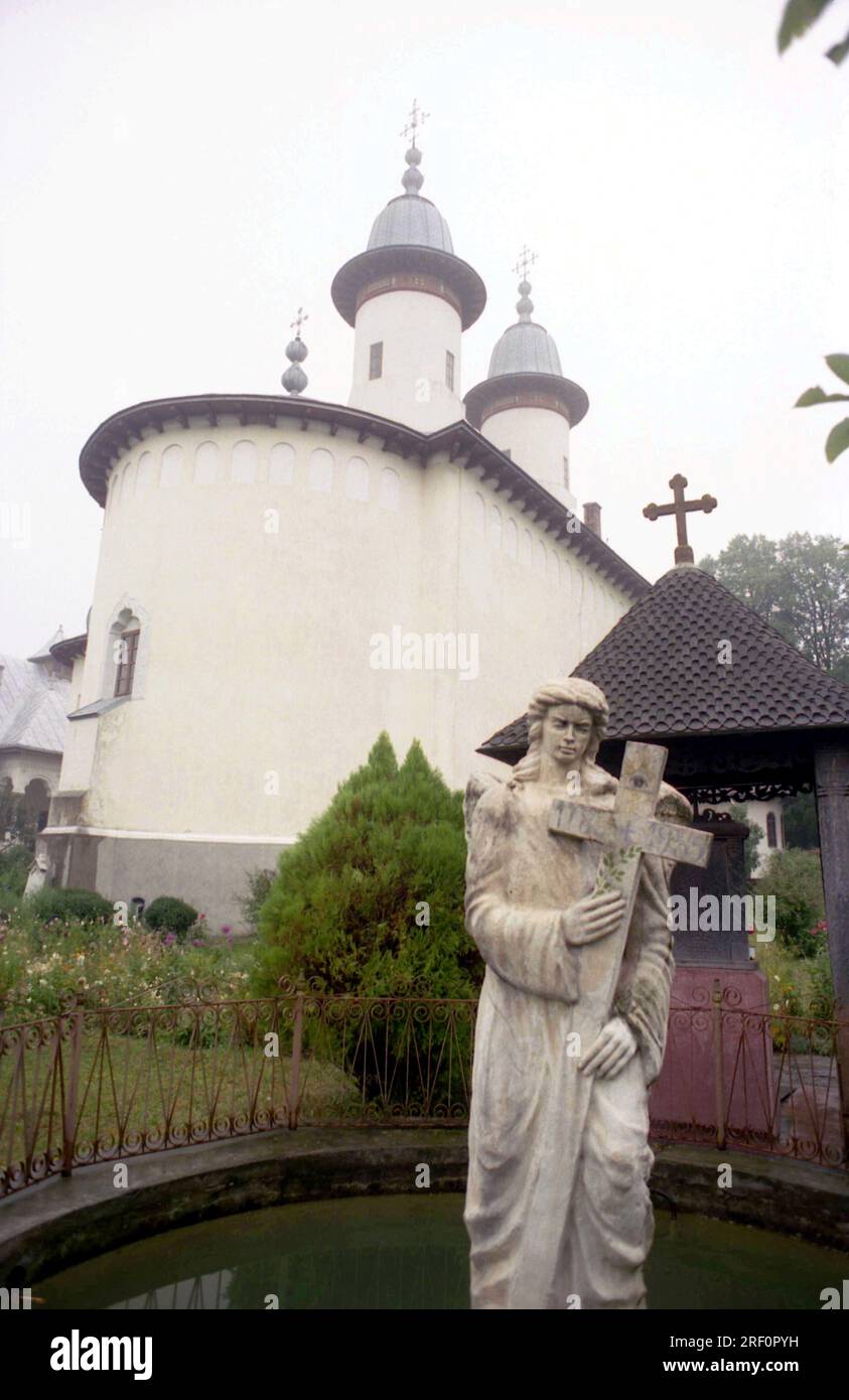 Angel holding on cross hi-res stock photography and images - Alamy