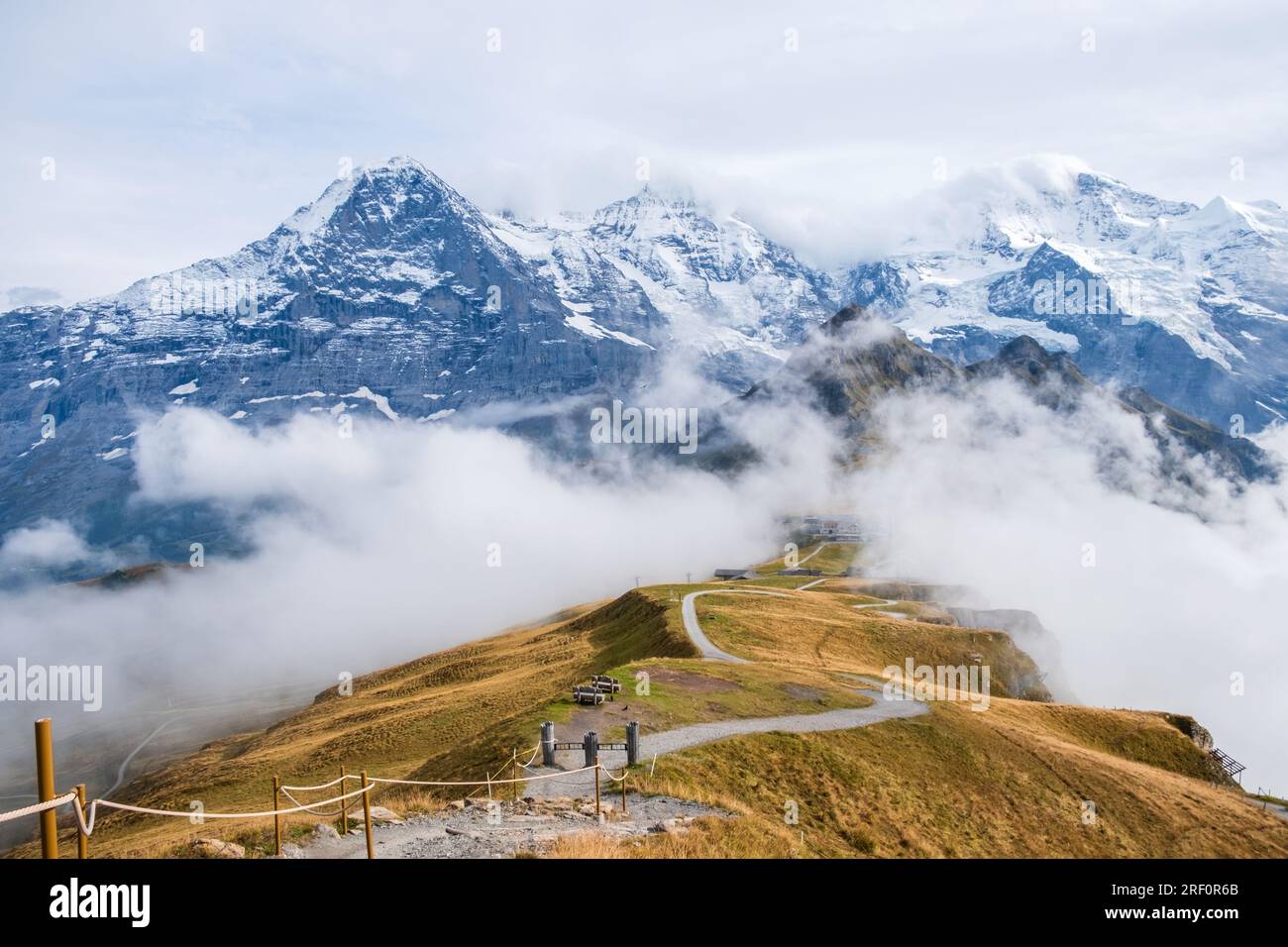 Autumn in Swiss Alps. Hiking trail on top of Mannlichen near Wengen and ...