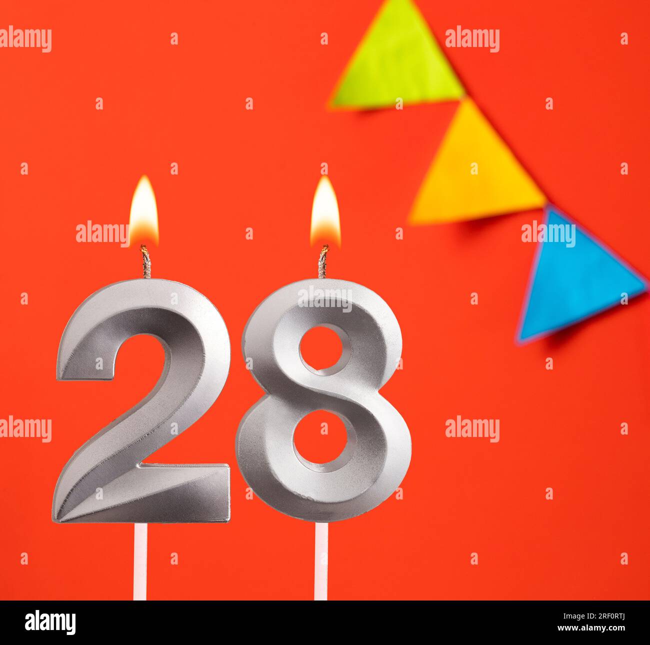 Birthday card - Number 28 candle in orange background Stock Photo - Alamy