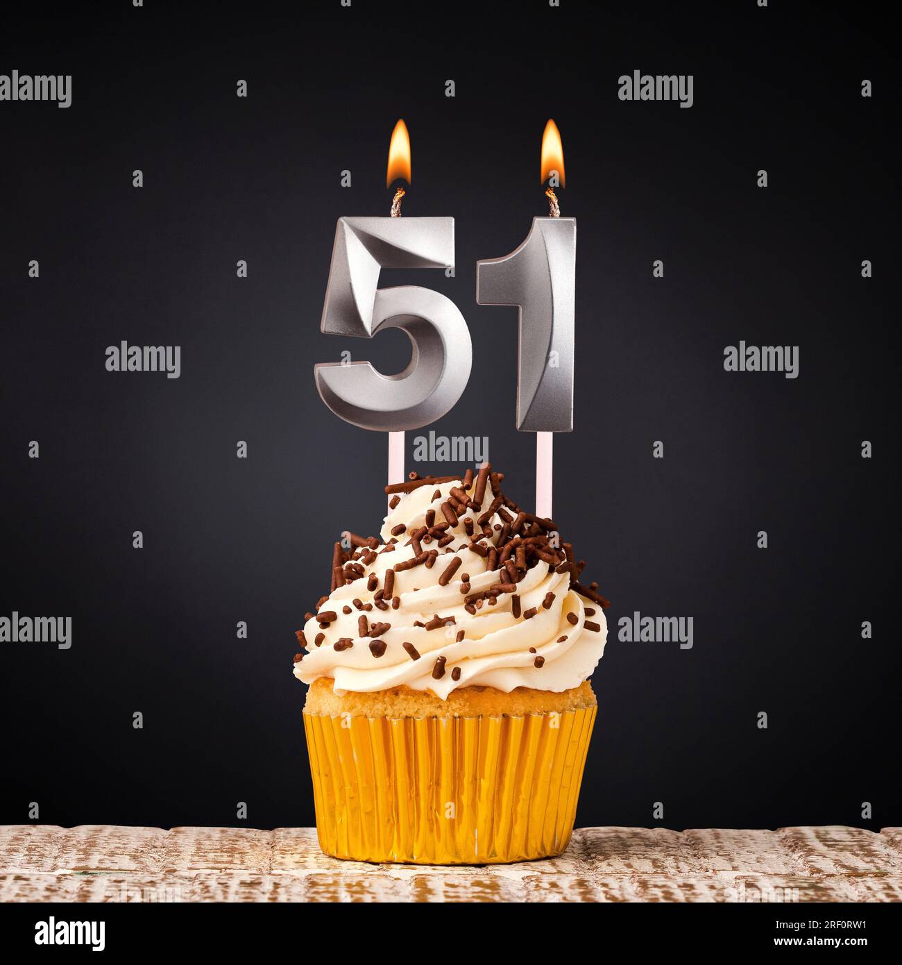 Birthday candle number 51 - Anniversary cupcake on black background ...
