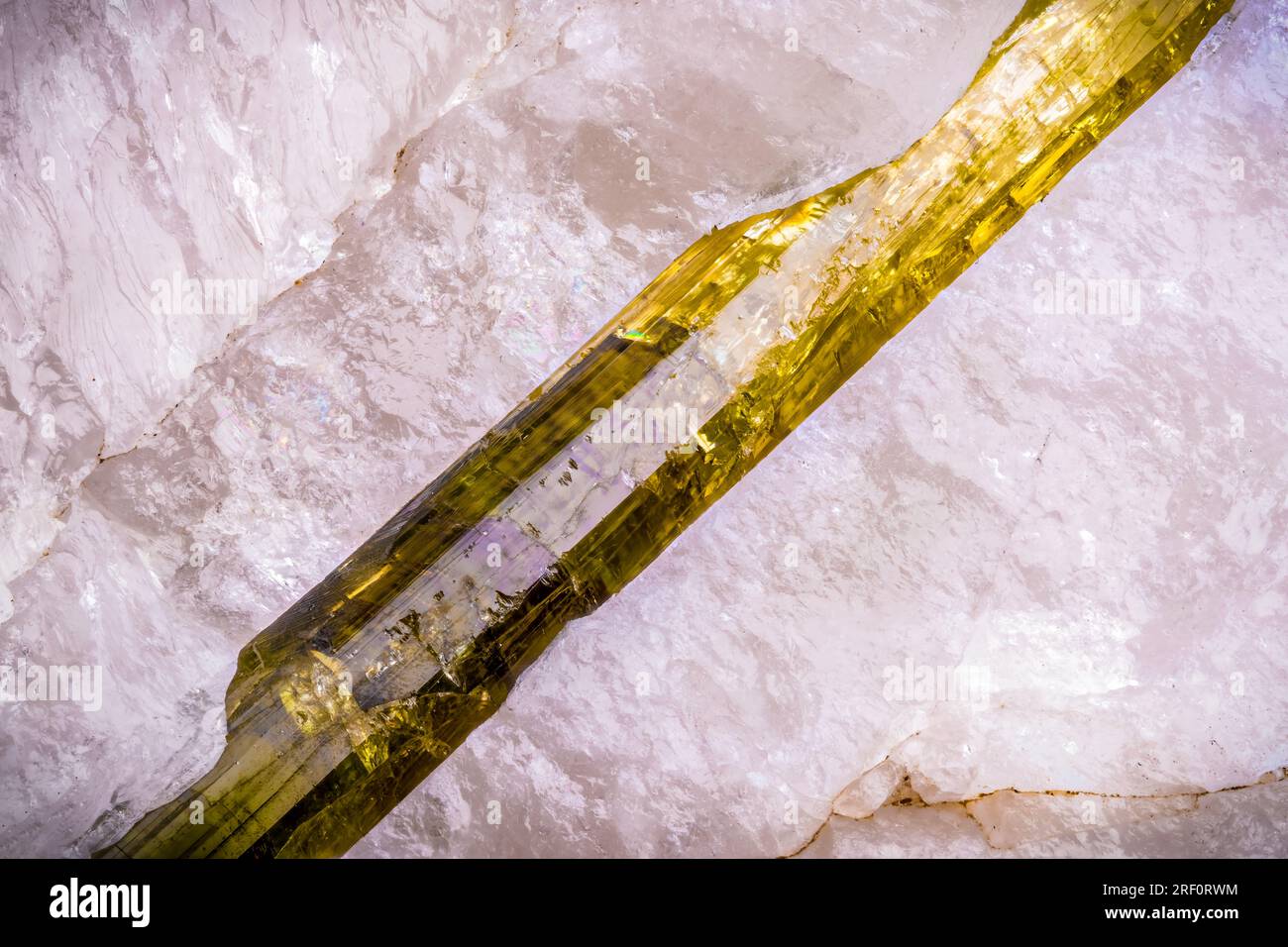 green tourmaline (Elbaite) on quartz macro detail texture background ...