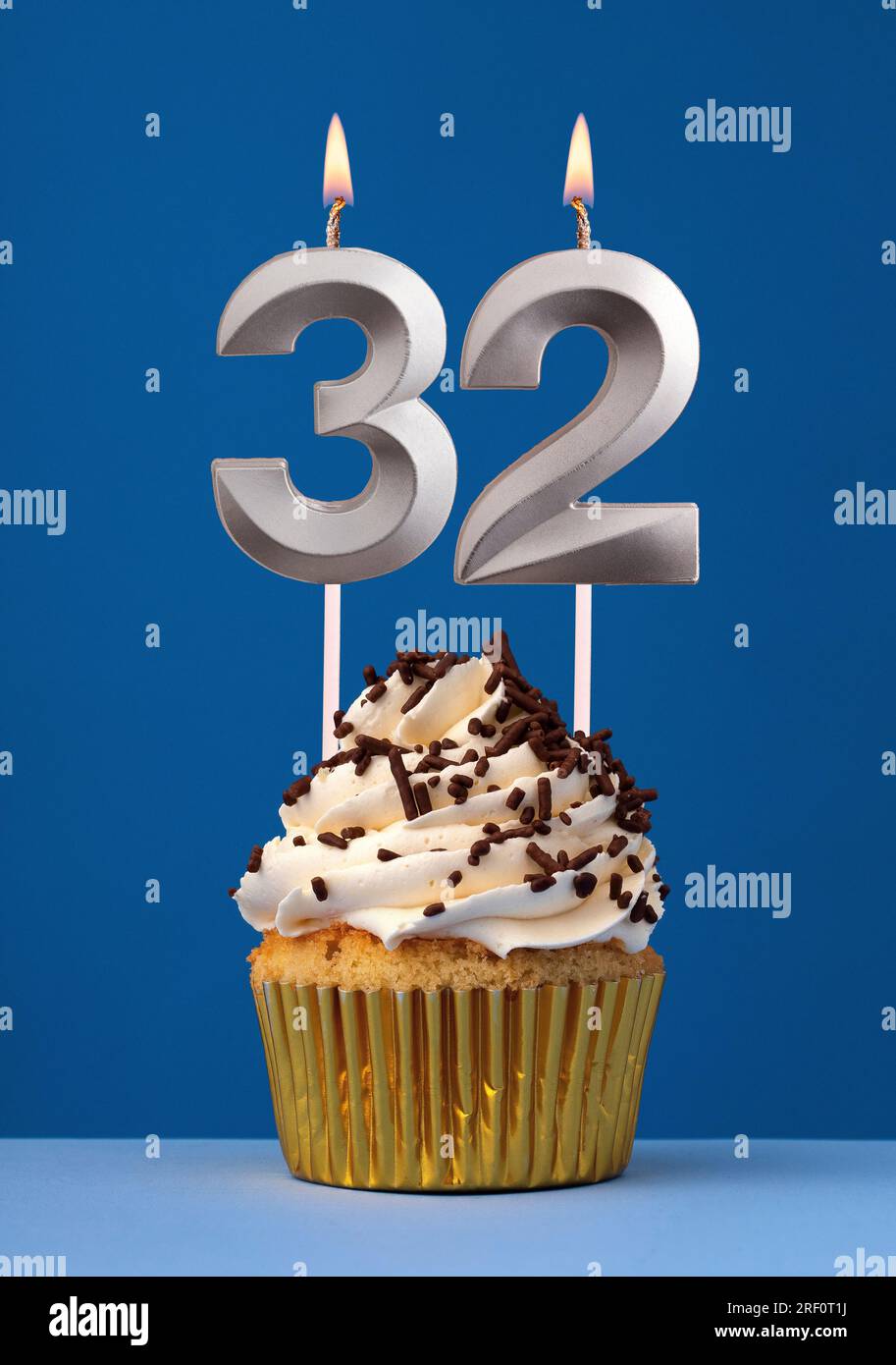 Horizontal birthday card with cake - Lit candle number 32 on blue ...