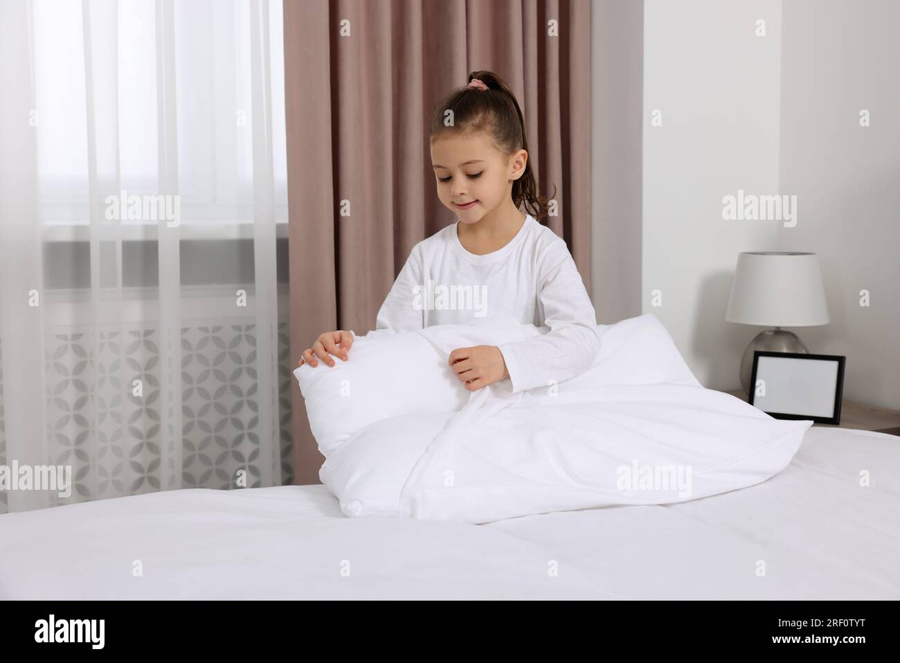 Kid make bed chore hi-res stock photography and images - Alamy
