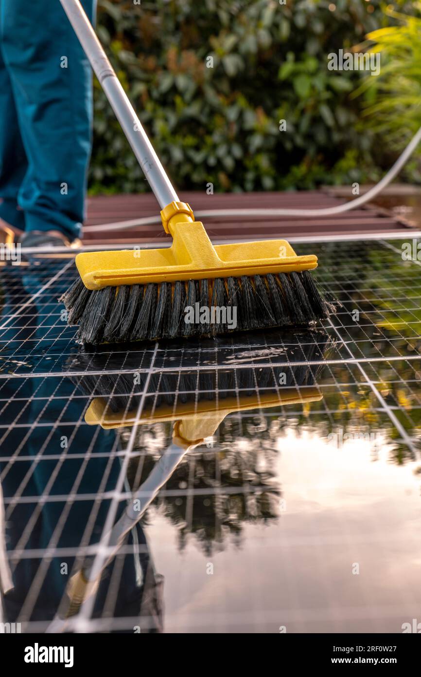 washing solar panels from dust and dirt with water close-up.Solar Panel ...