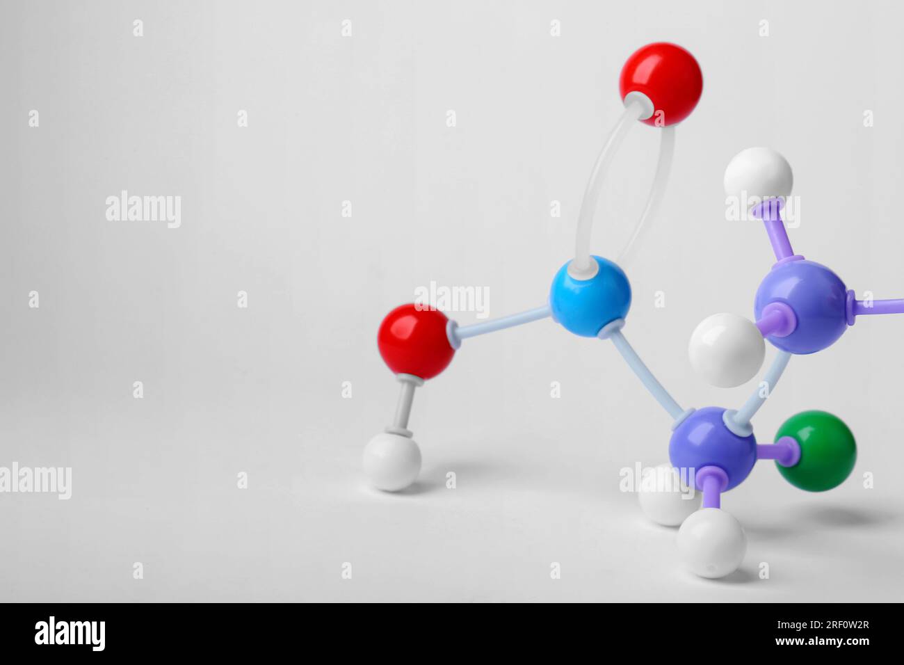 Structure of molecule on white background, closeup. Chemical model ...