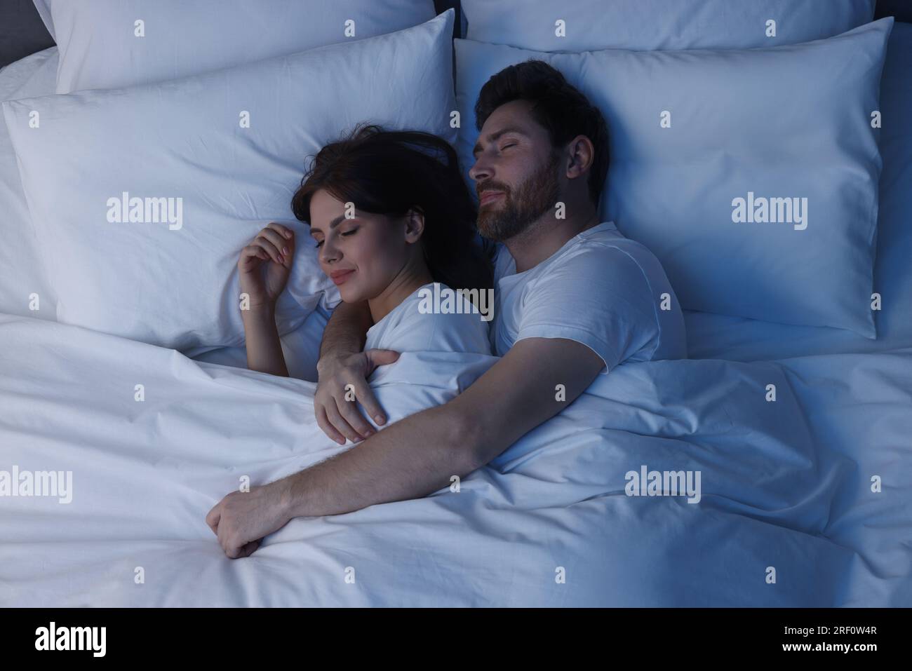 Couple asleep in bed at night hi-res stock photography and images - Alamy