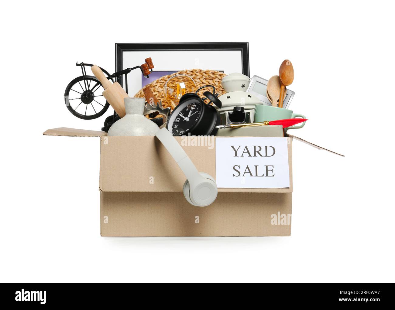 Sign Yard Sale written on box with different stuff isolated on white ...
