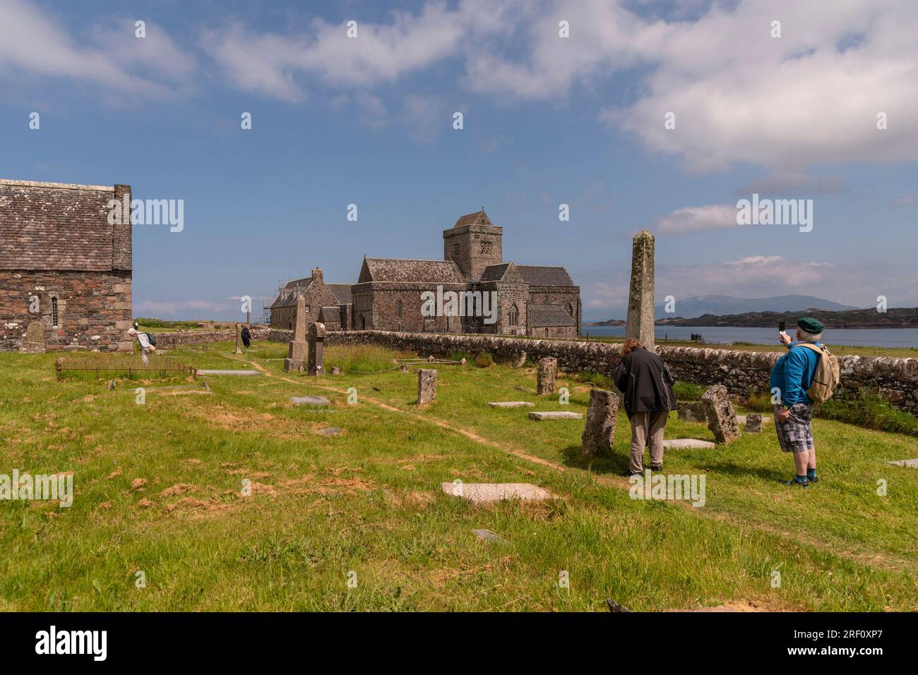 Isle of Iona, Argyll, Scotland, UK. 6 June 2023. Tourists viewing Iona ...