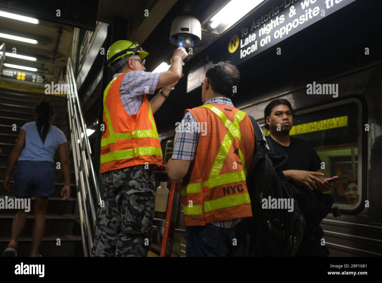 New York, New York, USA. 30th July, 2023. MTA workers install a ...