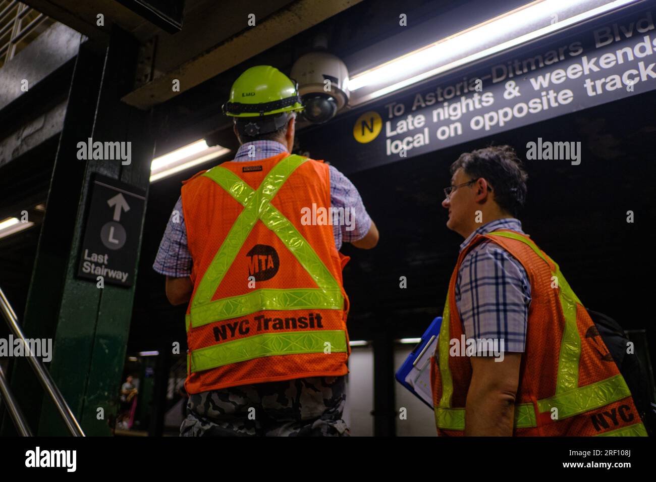 New York, New York, USA. 30th July, 2023. MTA workers install a ...