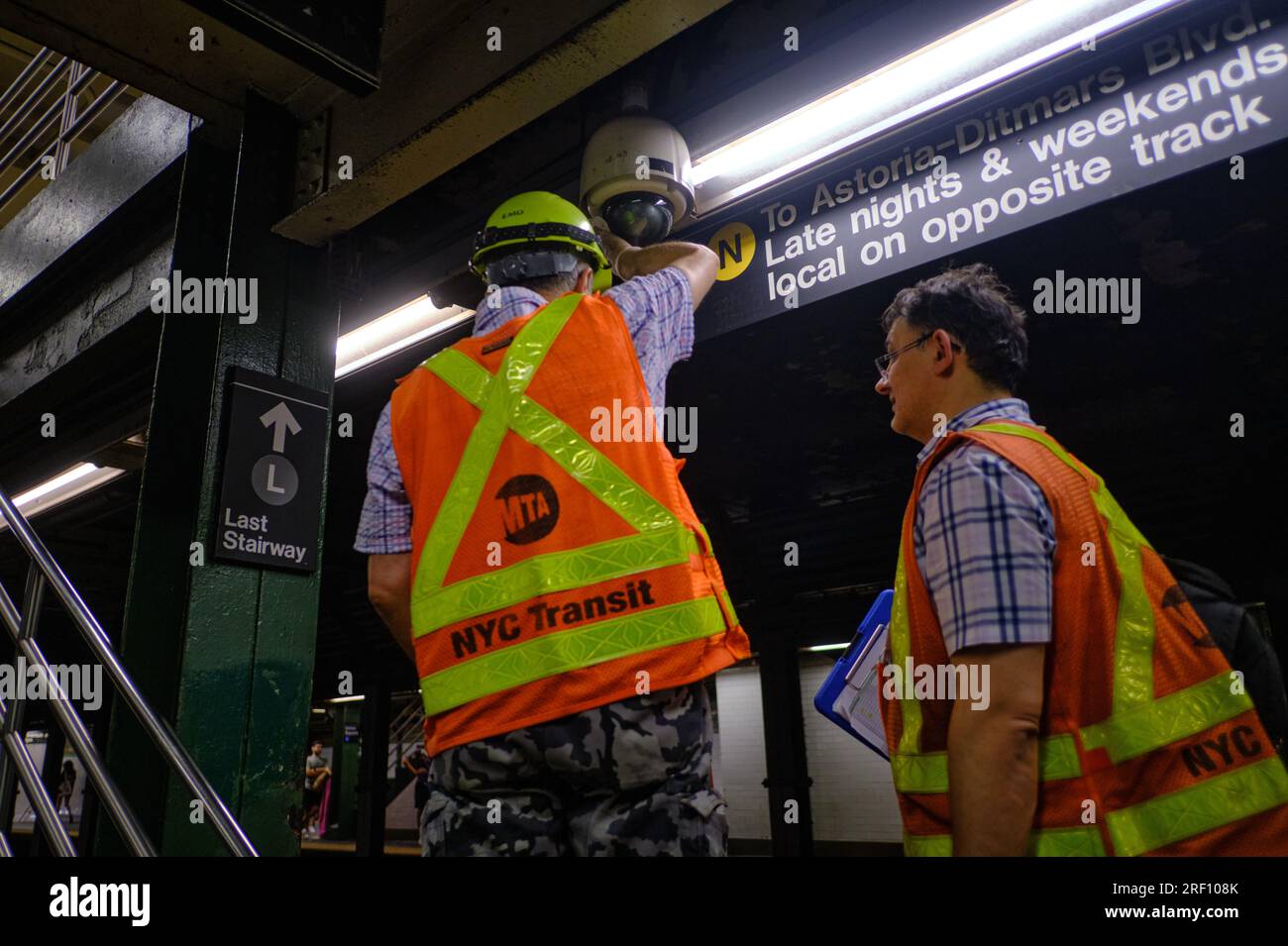New York, New York, USA. 30th July, 2023. MTA workers install a ...