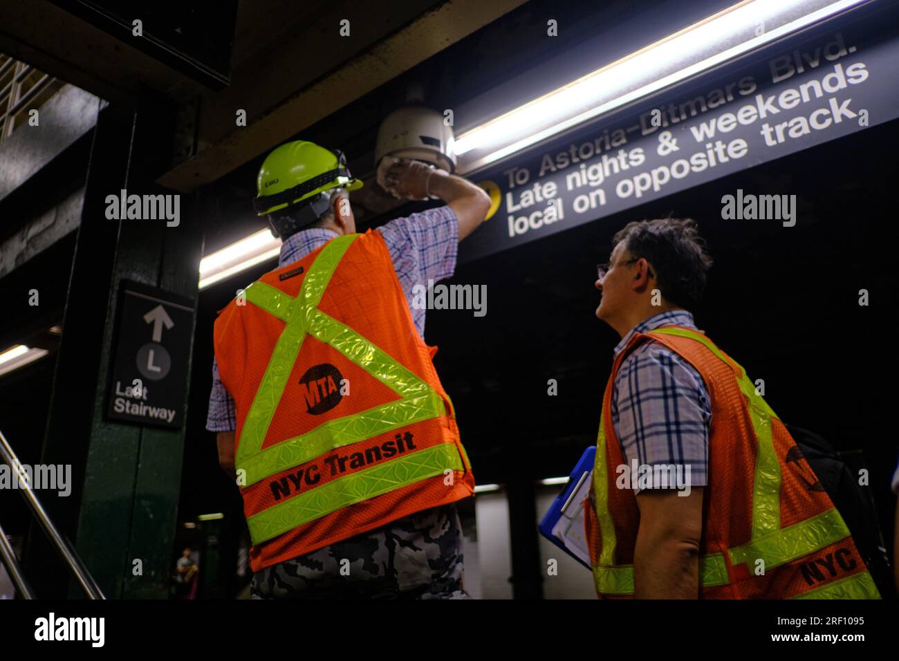 New York, New York, USA. 30th July, 2023. MTA workers install a ...