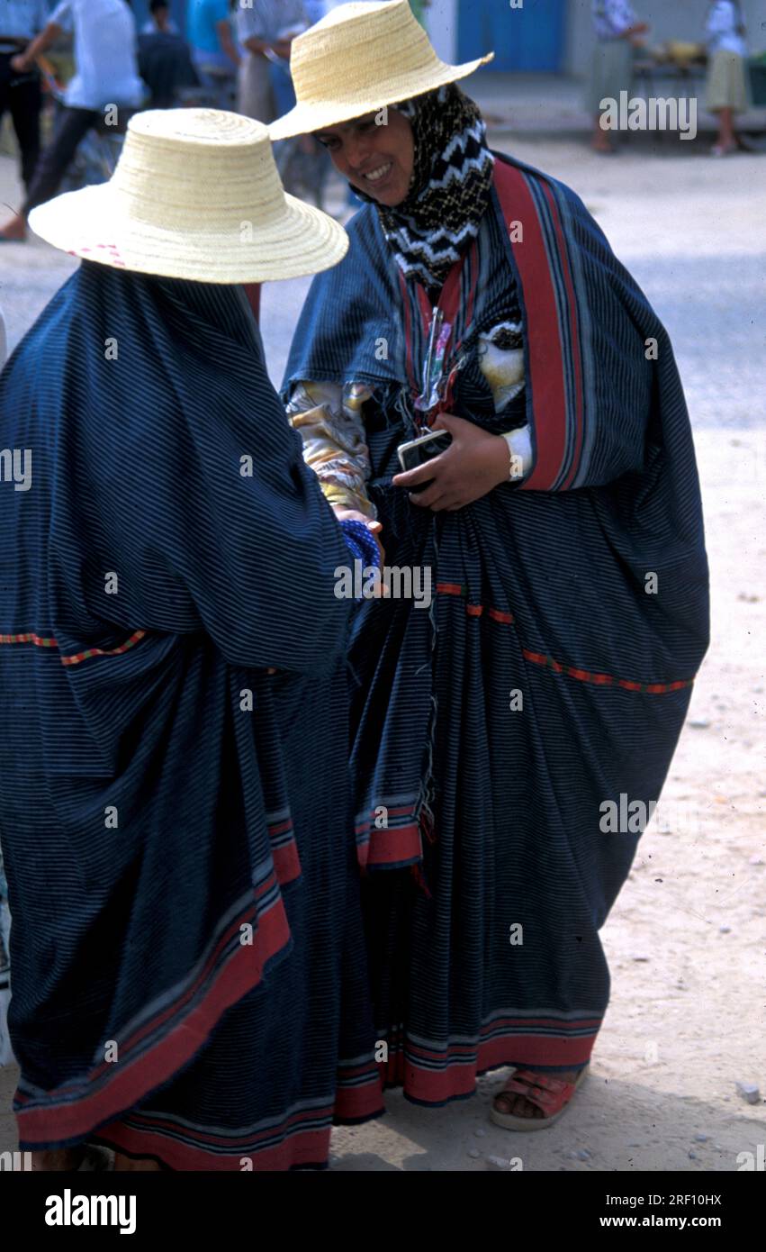 Two women wearing traditional dress, Djerba island, Tunisia Stock Photo ...