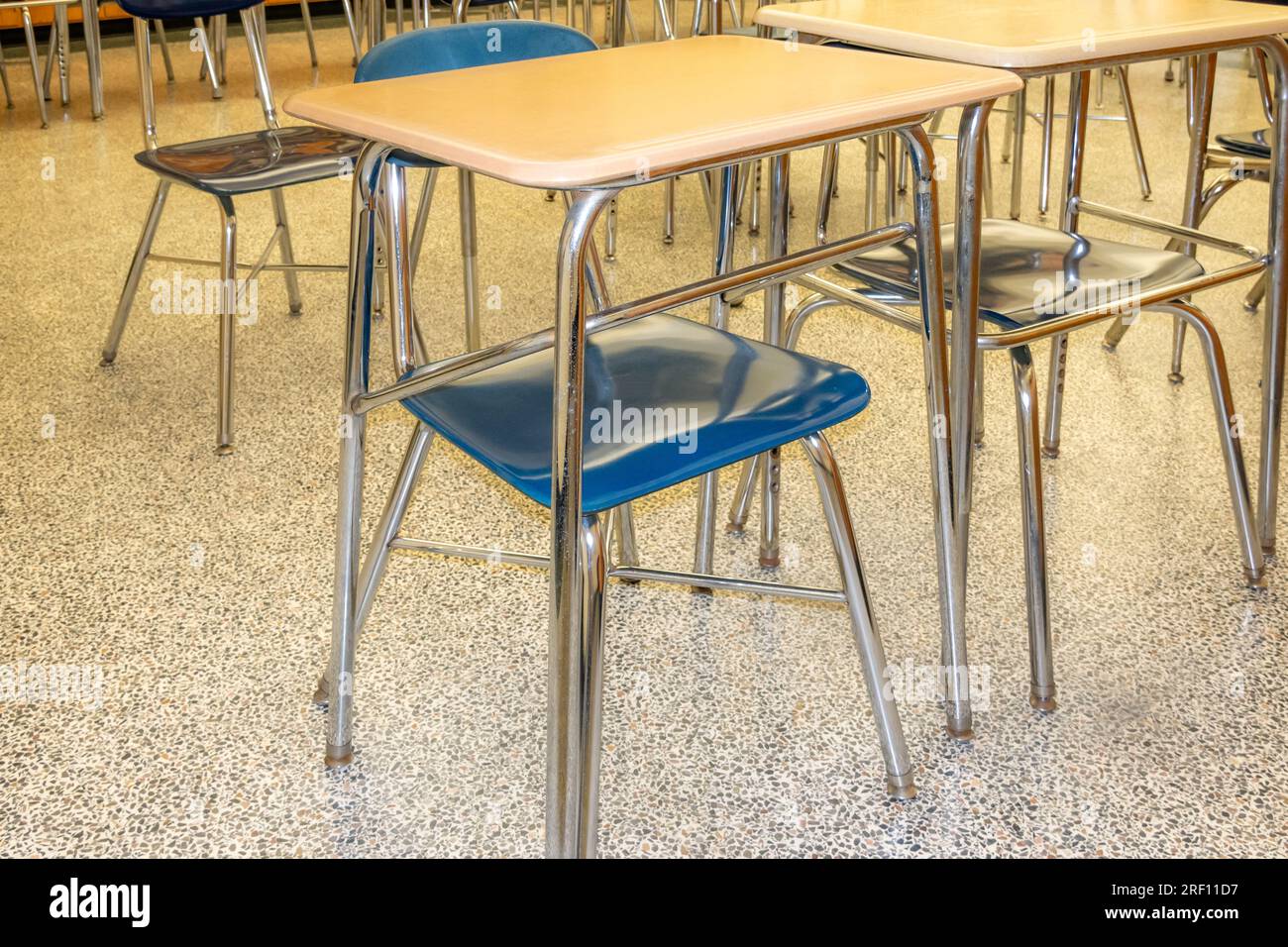 Example of an empty nondescript US High School Classroom with desks ...