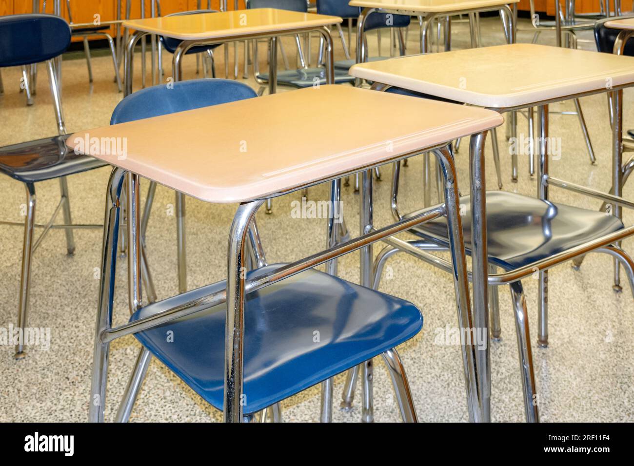 Example of an empty nondescript US High School Classroom with desks ...