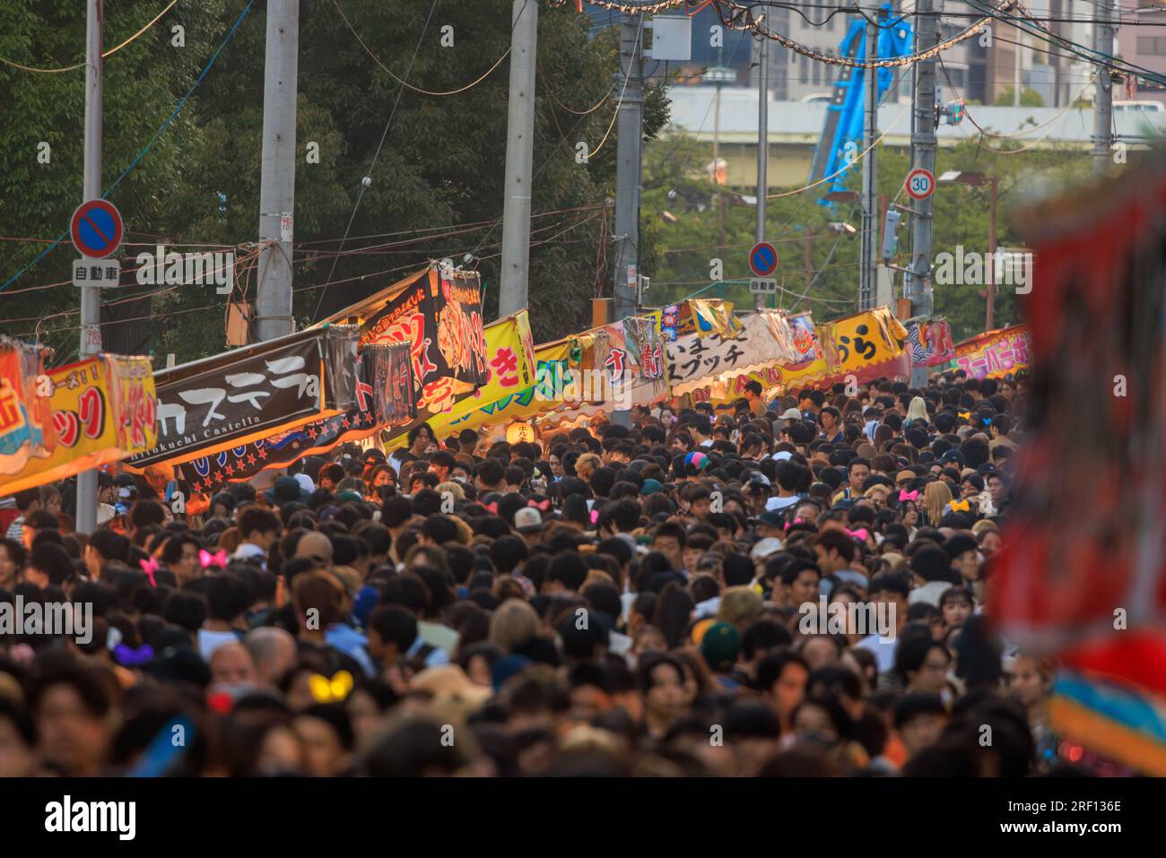 Osaka, Japan - July 25, 2023: Sea of people walk by food stalls on ...