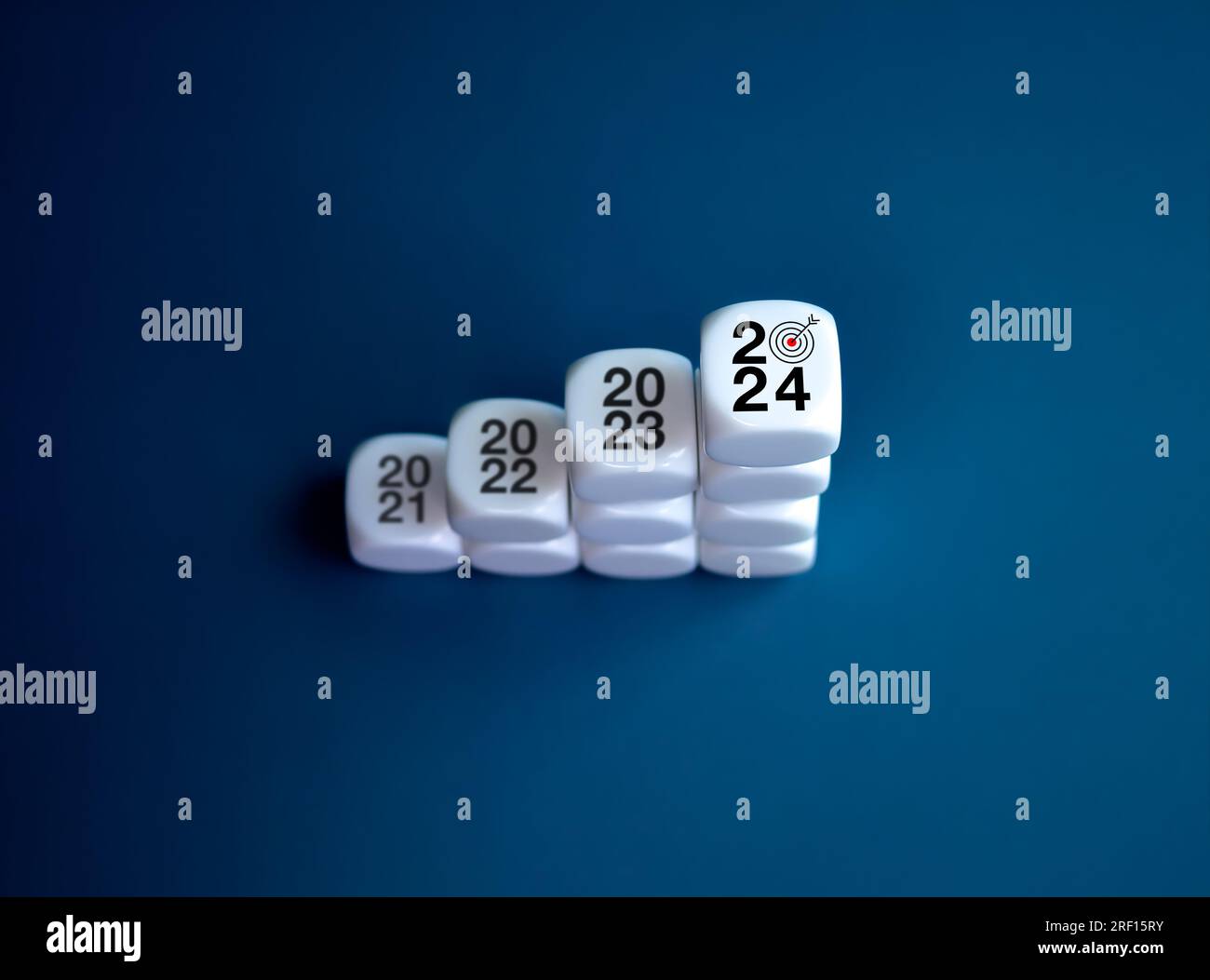 2024 year number with target icon on the top of white blocks as graph ...