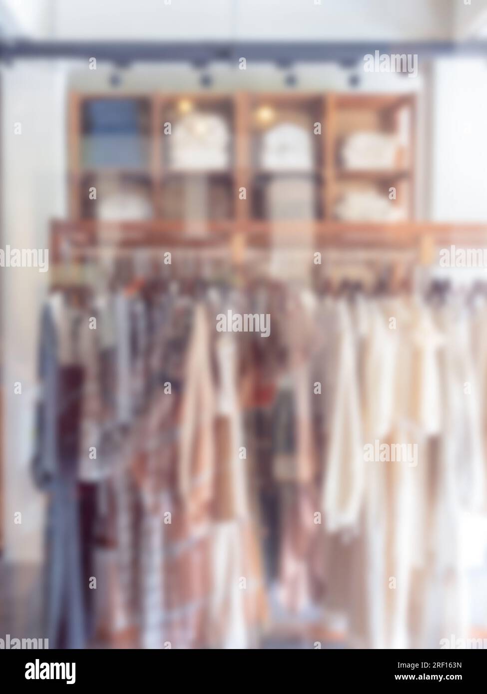 Abstract blurred modern clothes shop interior background, vertical ...