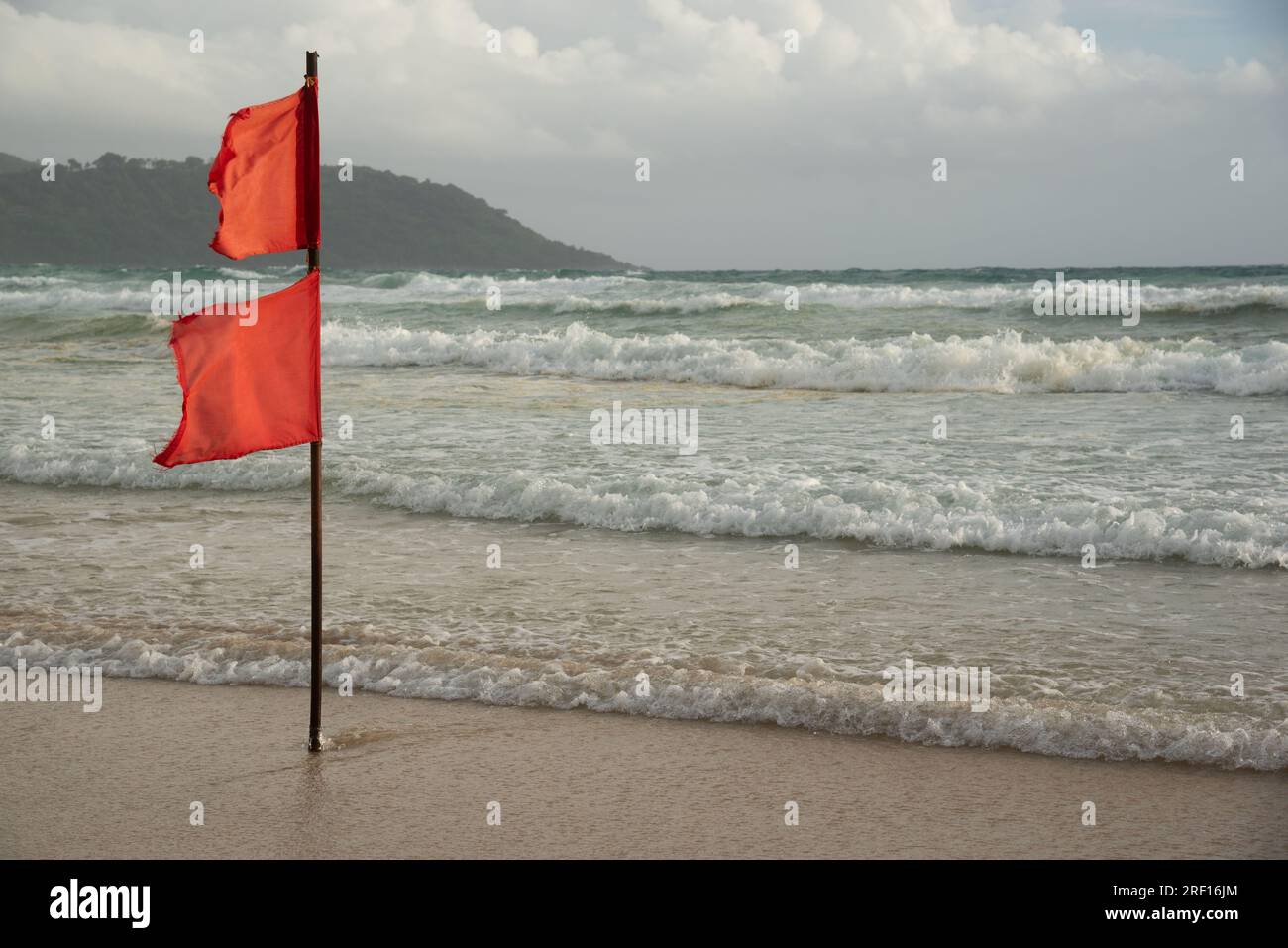 A red flag warning of danger of windy and seawaves on the beach during ...