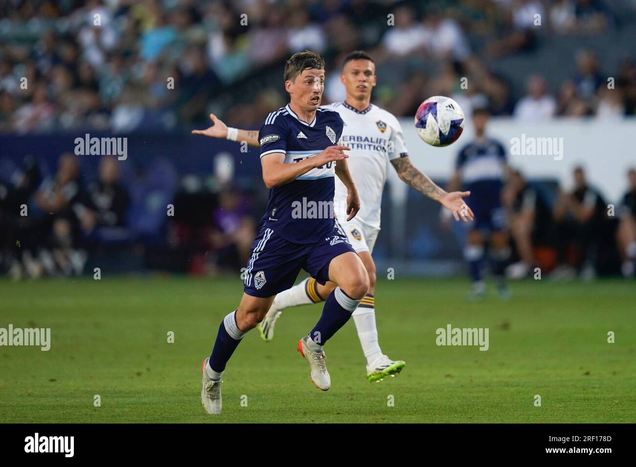 Vancouver Whitecaps midfielder Ryan Gauld chases down the ball during the second half of a ...