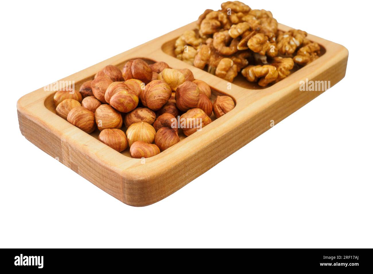 Wooden rack with assorted shelled nuts isolated on white background ...