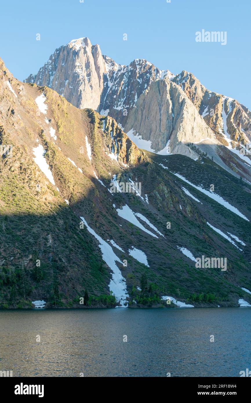 Tranquil mountain lake along the scenic McGee Pass Trail route Stock ...