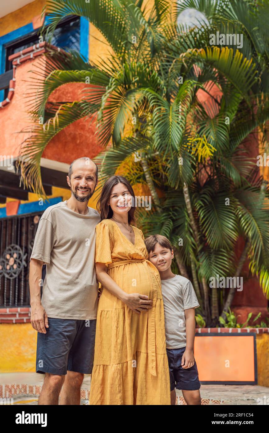 A loving couple in their 40s and their teenage son cherishing the ...