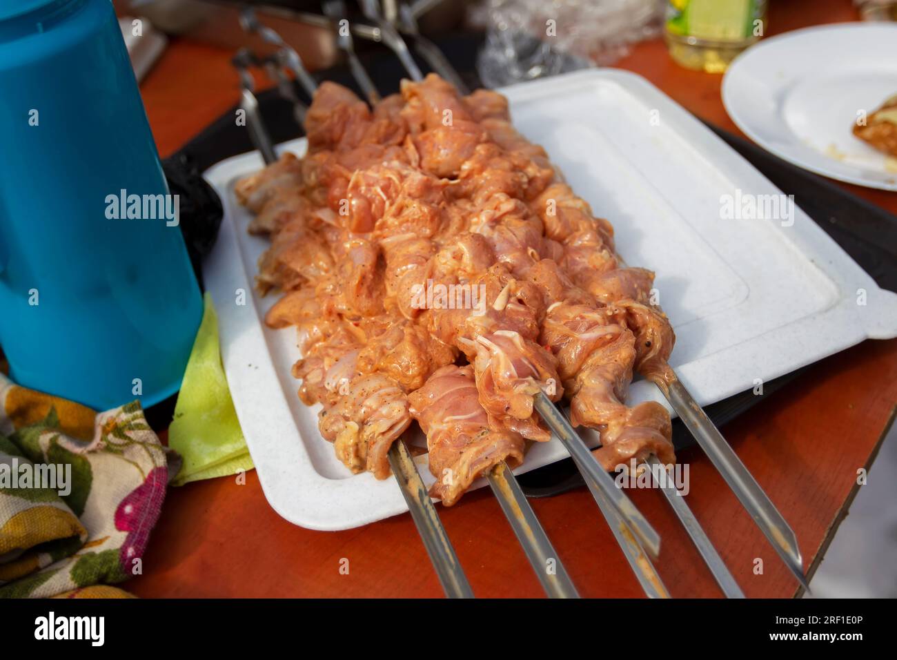 Chicken skewers marinated on skewers and ready to cook. Semi-finished ...