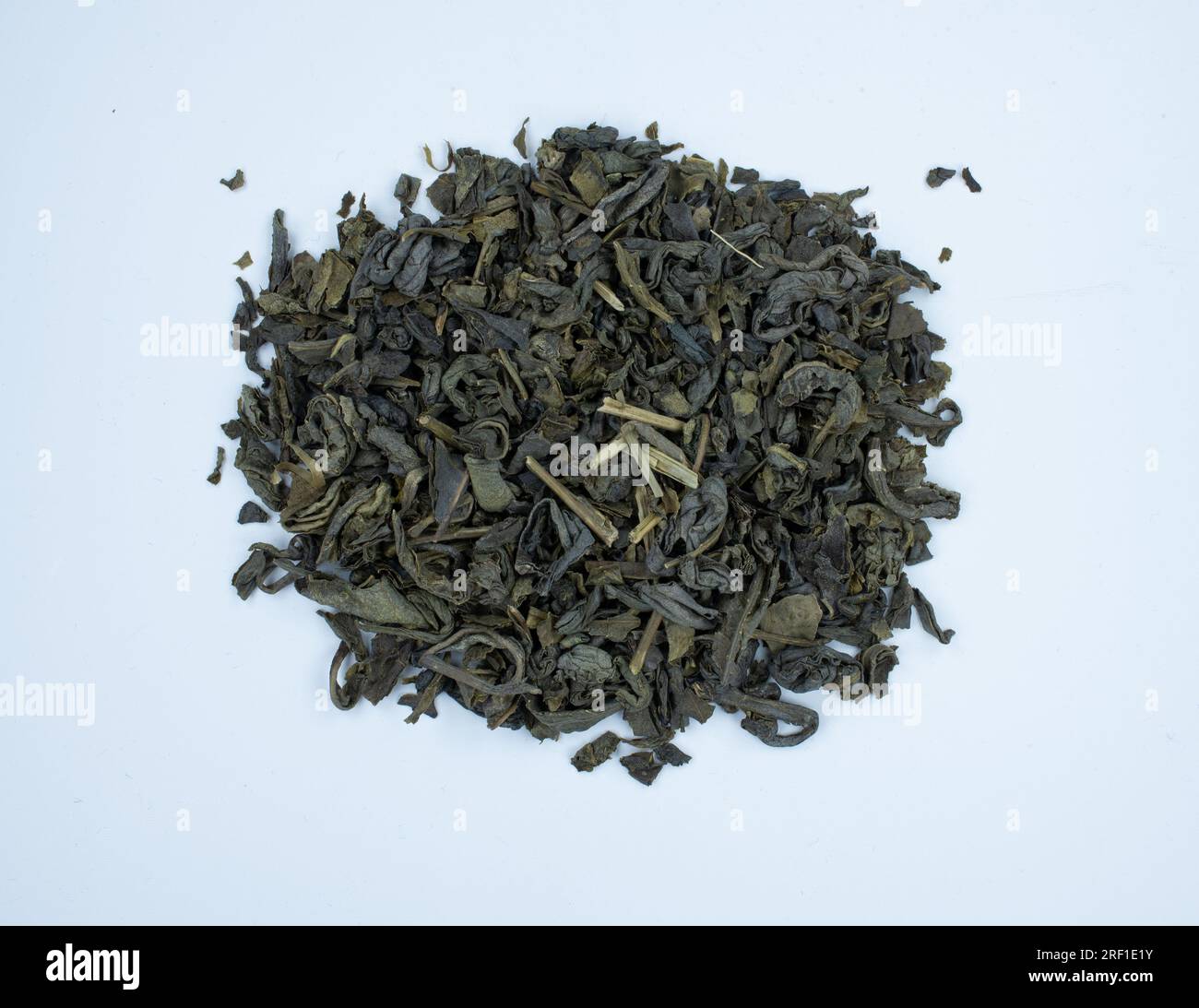 Dried Tea leaves on white background Stock Photo - Alamy