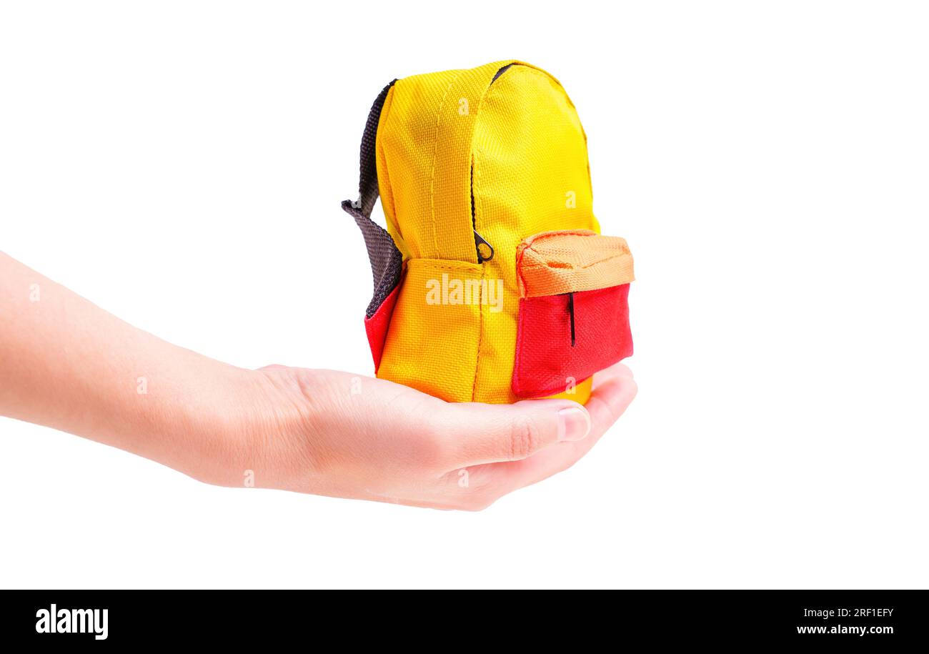 Stylish and compact tiny yellow and red backpack set on isolated on ...
