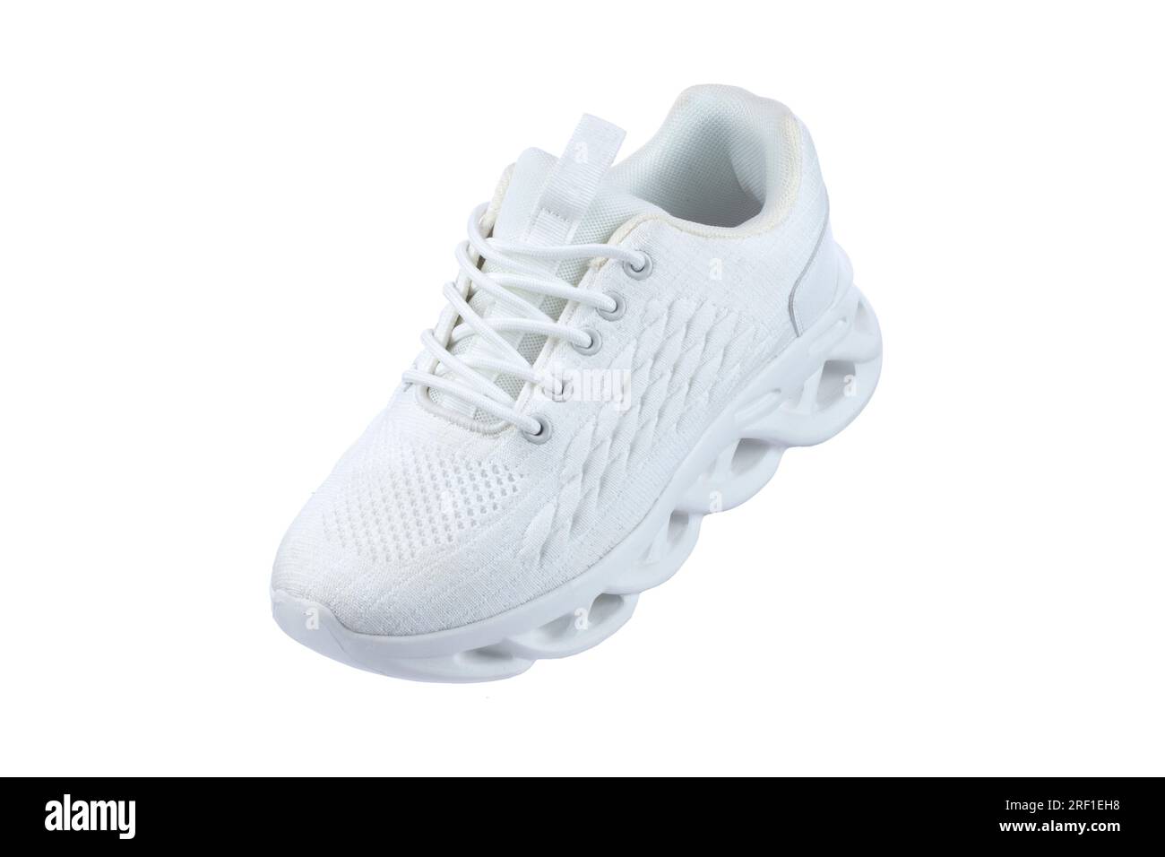 White sneaker made of fabric and textured twisted sole on a white ...