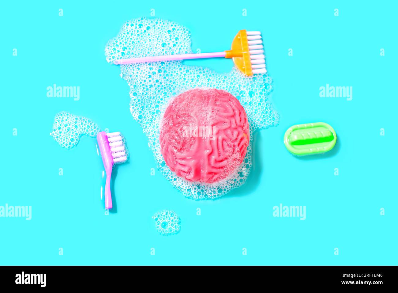 Human brain model surrounded by frothy foam, accompanied by essential ...