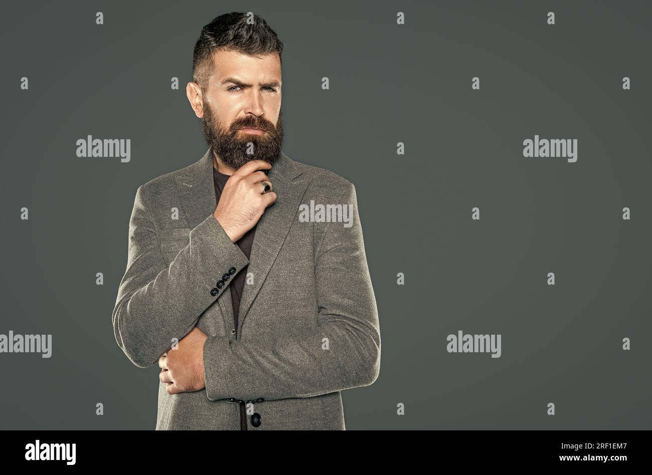 bearded thinking man wear casual on grey background Stock Photo - Alamy