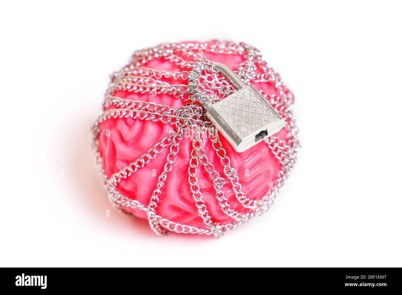 Close-up of a human brain model confined by chains and secured with a ...