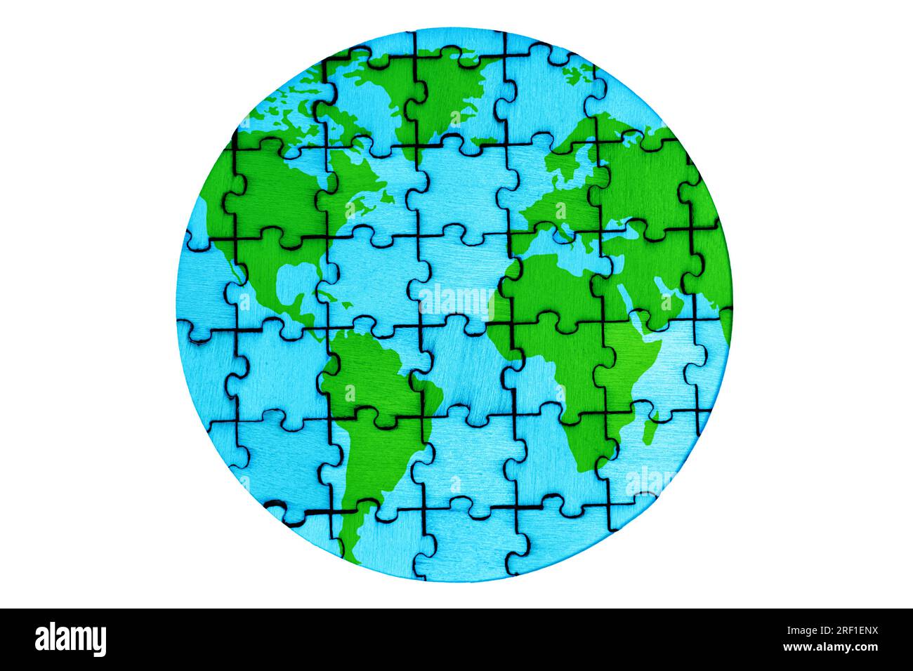 Jigsaw puzzle pieces arranged into a flat green and blue globe shape on ...