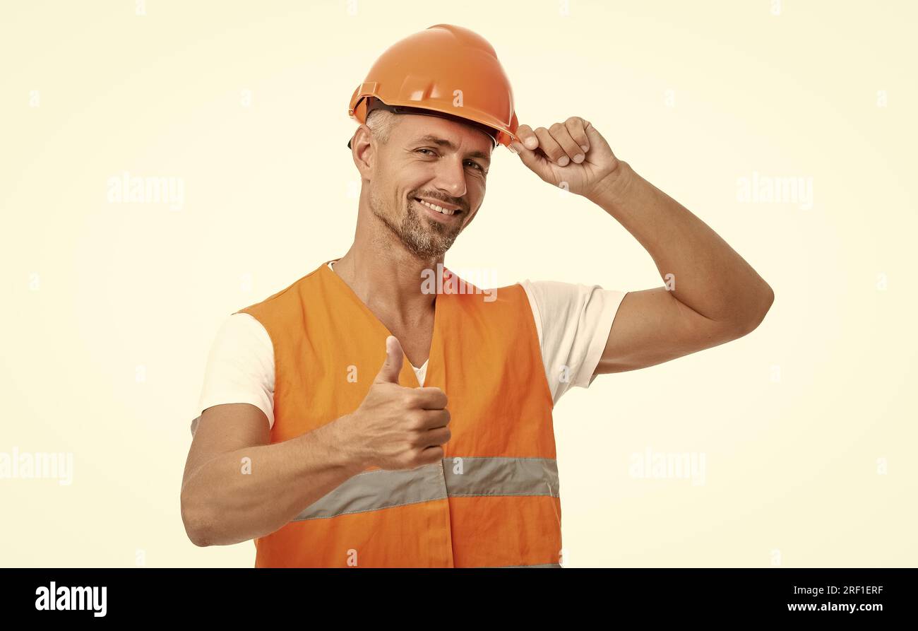 man laborer on background, thumb up. photo of man laborer wearing ...